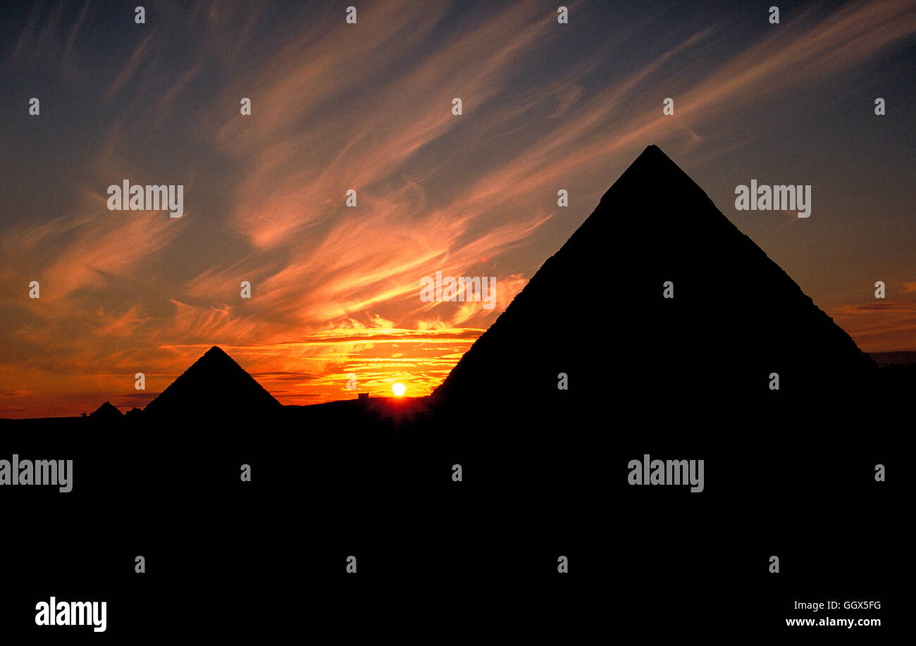 Sunset behind the Great Pyramids of Giza. Cairo - Egypt Stock Photo - Alamy