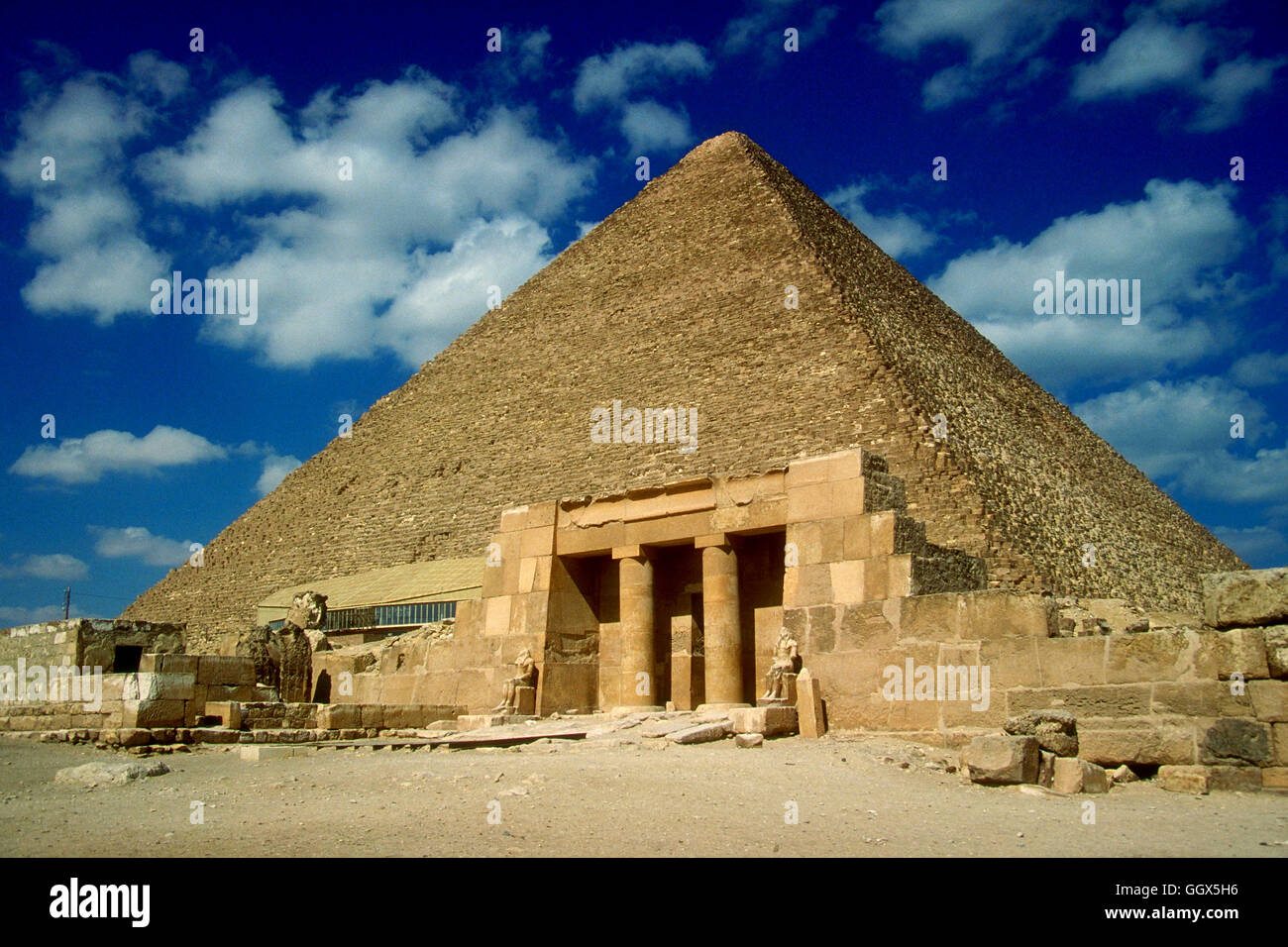 Restored mortuary temple facade and the Great Pyramid of Cheops at Giza ...