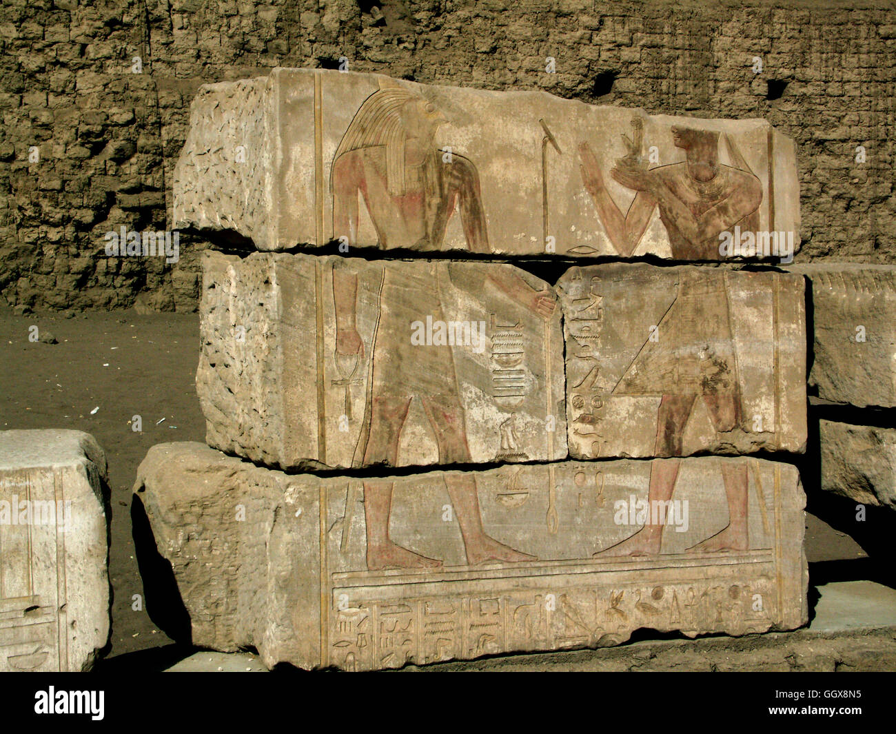 Wall of a small Roman temple with colorful reliefs at the Ptolemaic ...
