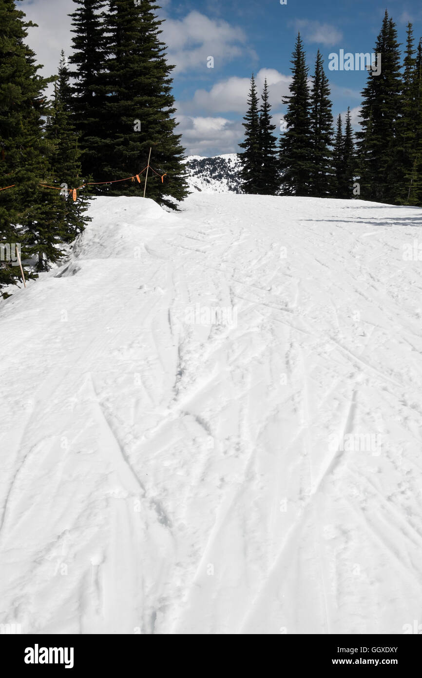Ridge top track in an alpine ski area with tracks in the snow Stock ...