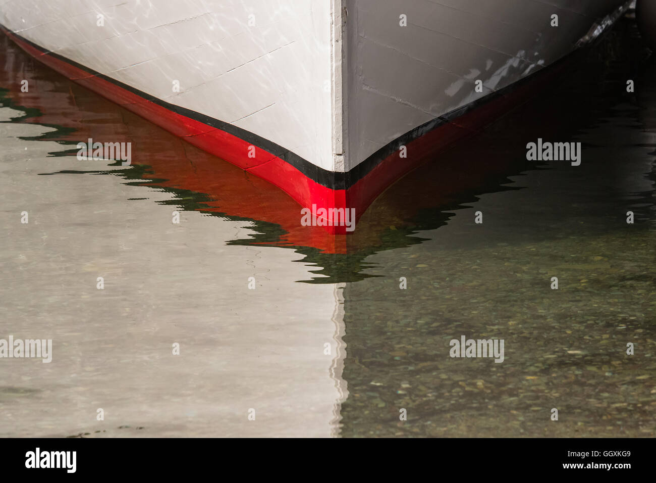 Red Bow of Boat at Waterline in shallow water Stock Photo - Alamy