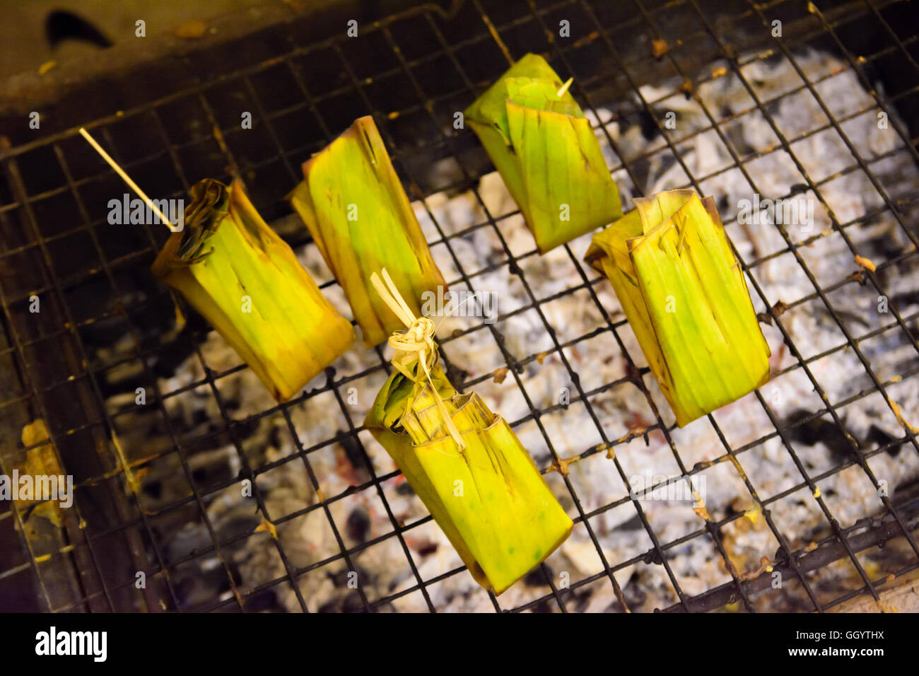 Sticky rice grill in market thailand Stock Photo - Alamy