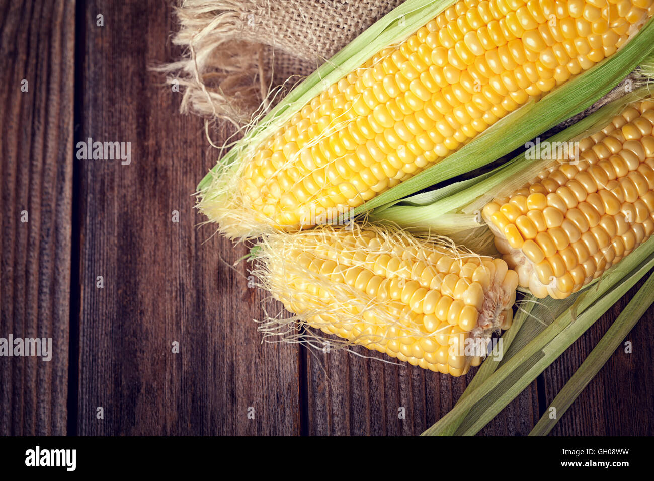 sweet corn on wooden background Stock Photo - Alamy