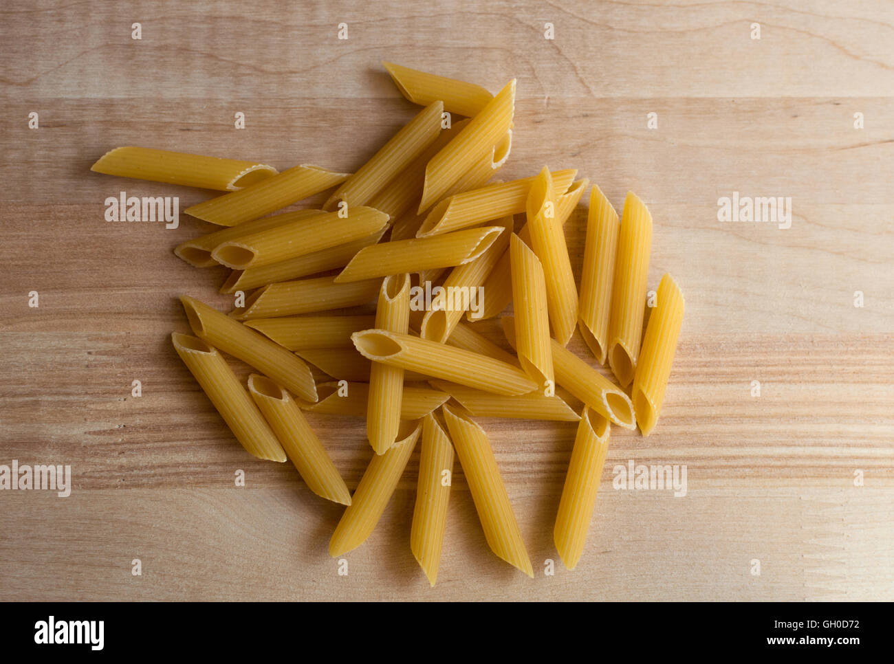 Raw italian pasta mixed on wooden desk. Natural light Stock Photo - Alamy