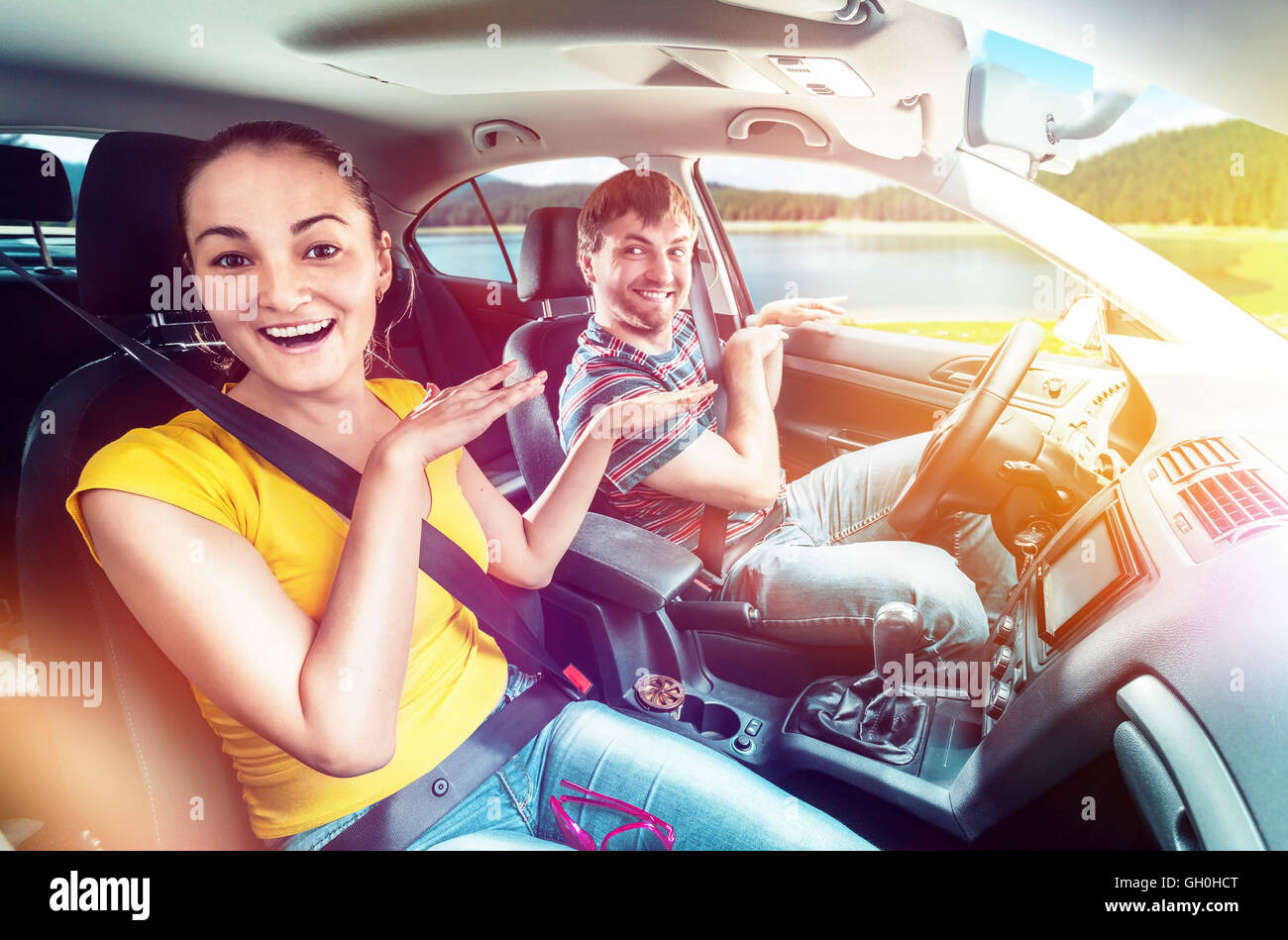 Couple having fun in the car Stock Photo - Alamy