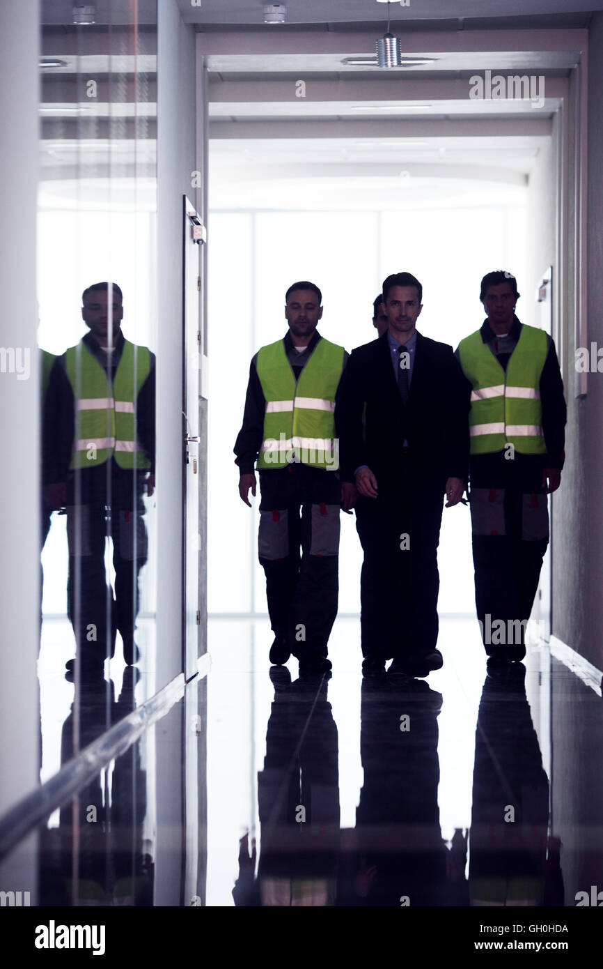 Business man walking into factory hi-res stock photography and images ...