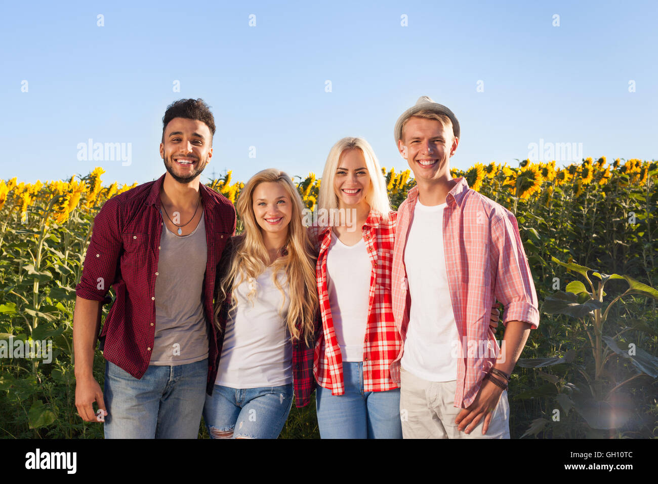 People group friends outdoor countryside sunflowers field Stock Photo ...
