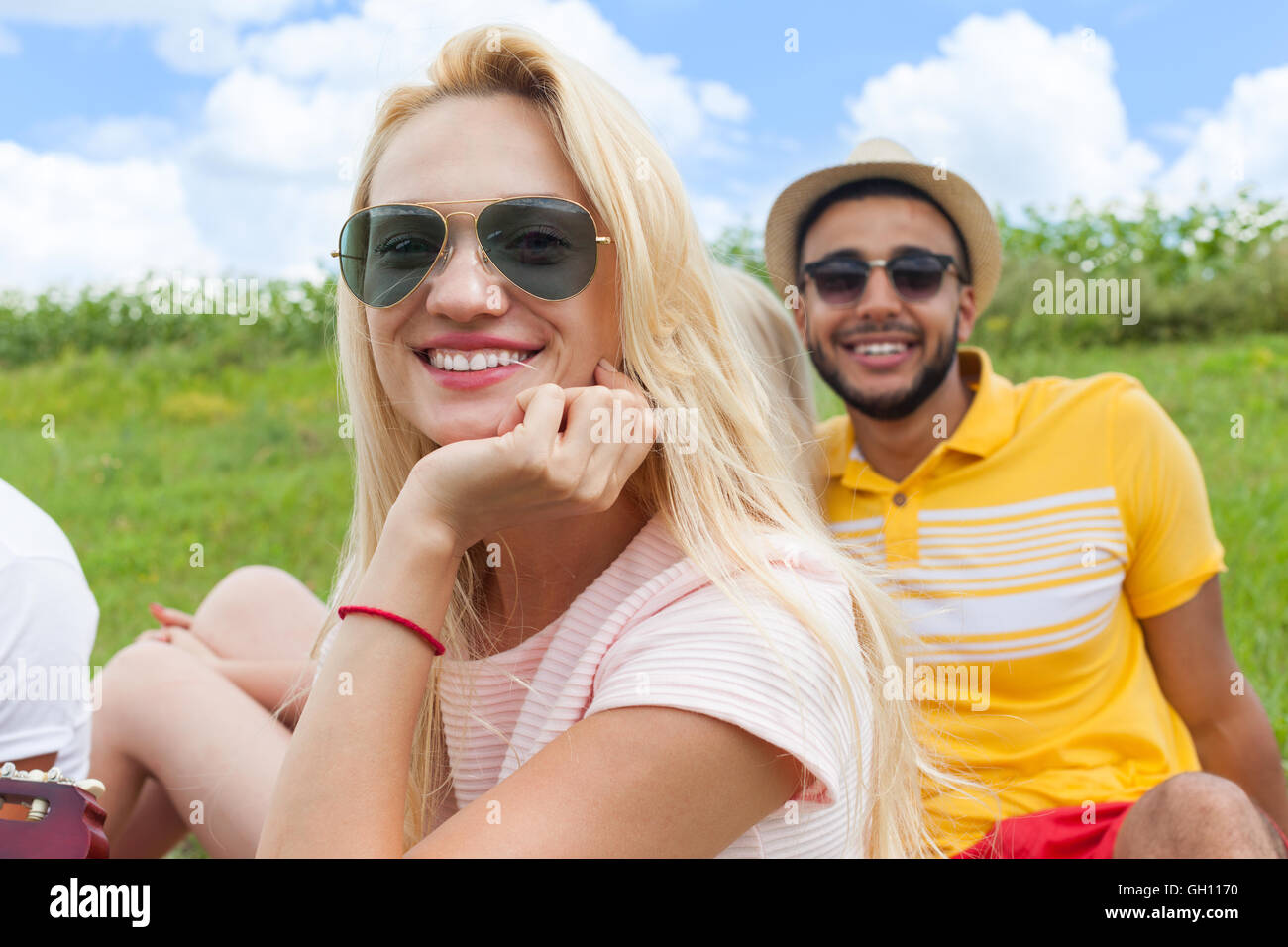 Woman face close up outdoor green grass Stock Photo - Alamy