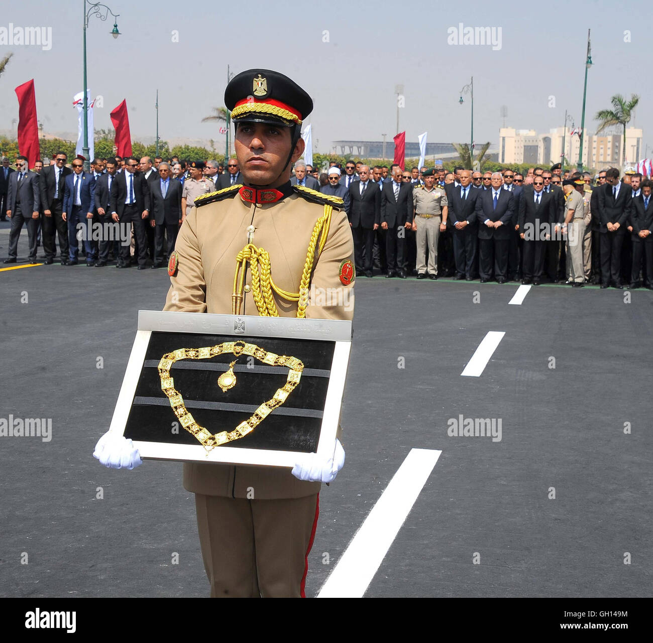 Cairo, Egypt. 7th Aug, 2016. An officer carries the Order of the Grand ...