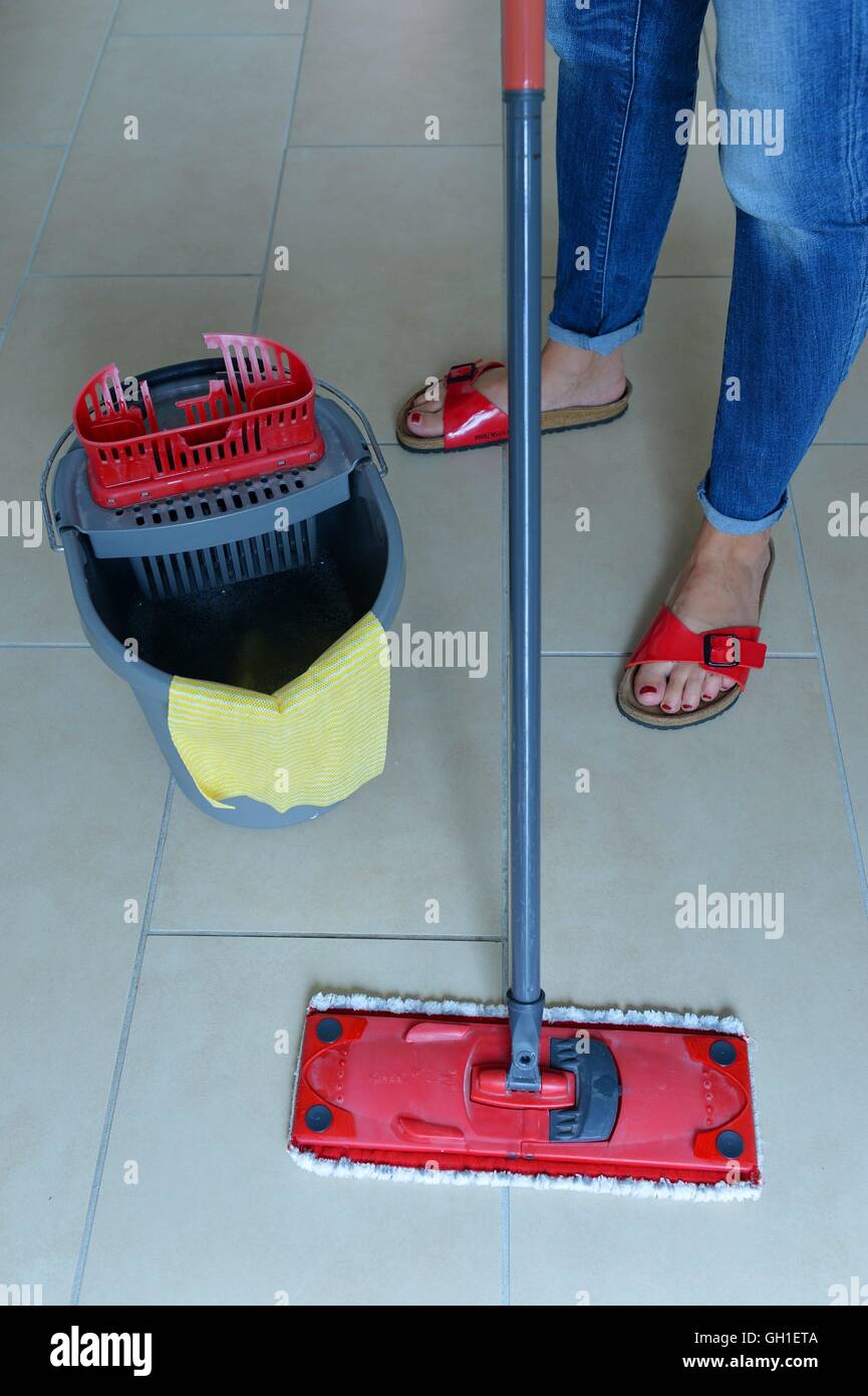 Woman sweeping stairs hi-res stock photography and images - Alamy