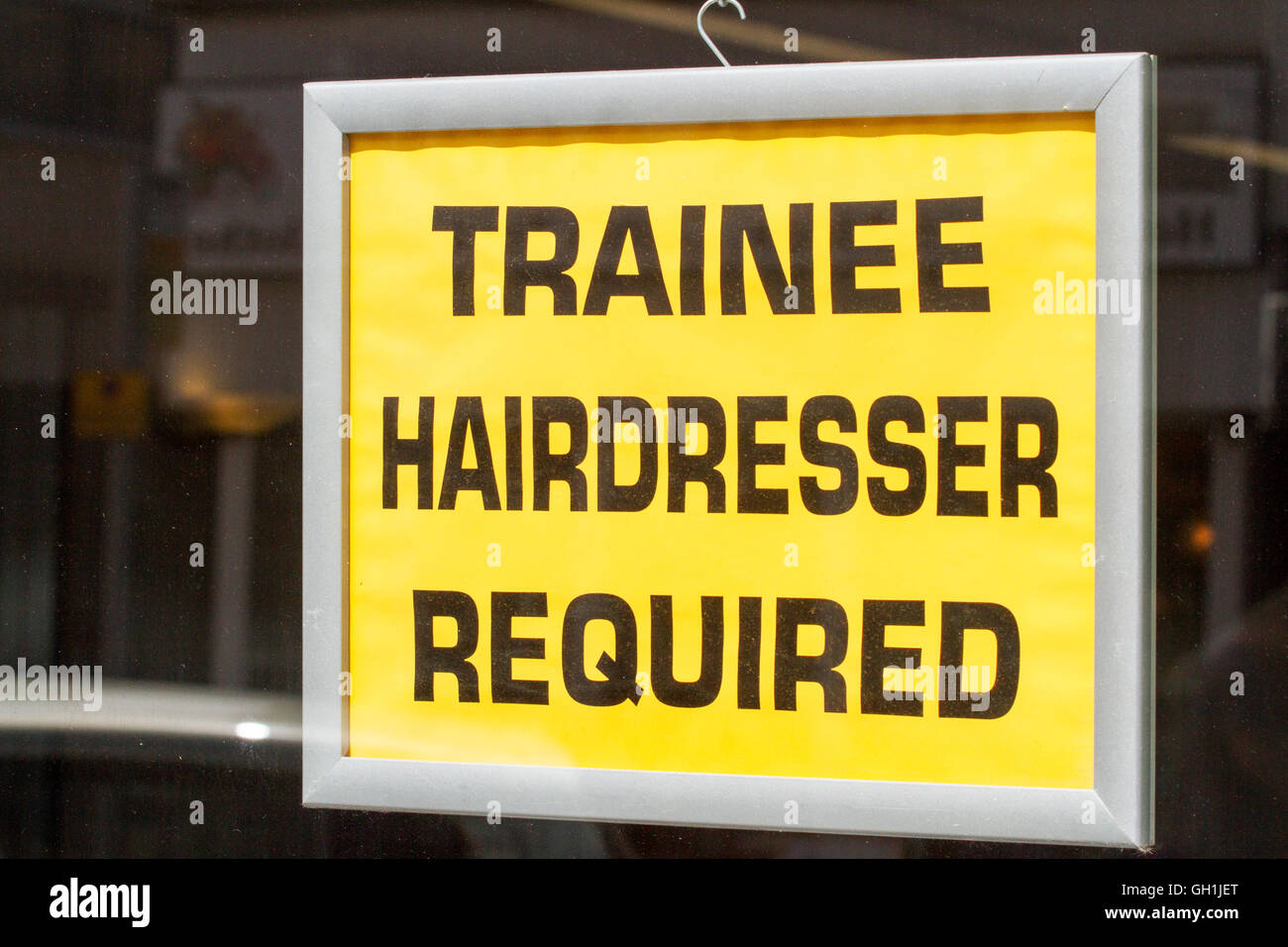 Trainee Hairdresser Required Sign Stock Photo - Alamy