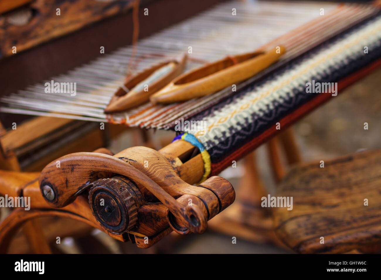 A closeup image of an old weaving Loom and thread of yarn Stock Photo ...