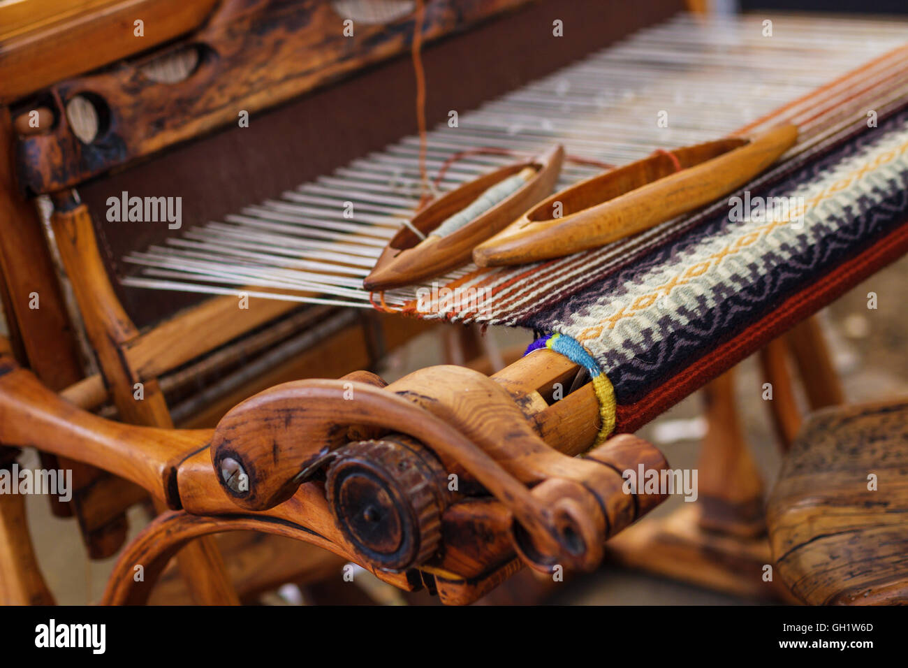A closeup image of an old weaving Loom and thread of yarn Stock Photo ...