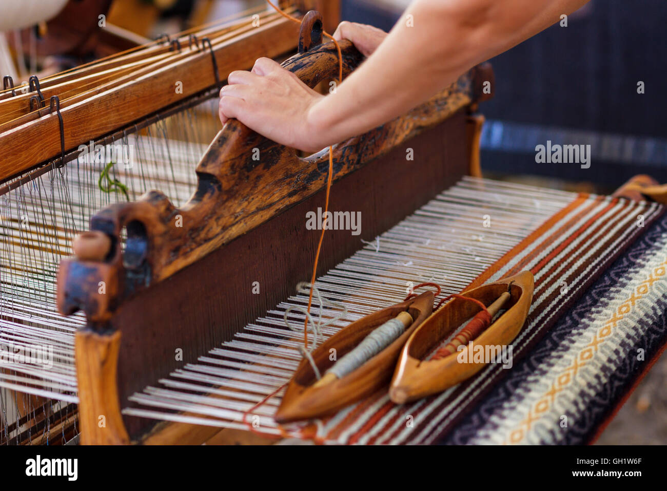 A closeup image of an old weaving Loom and thread of yarn Stock Photo ...