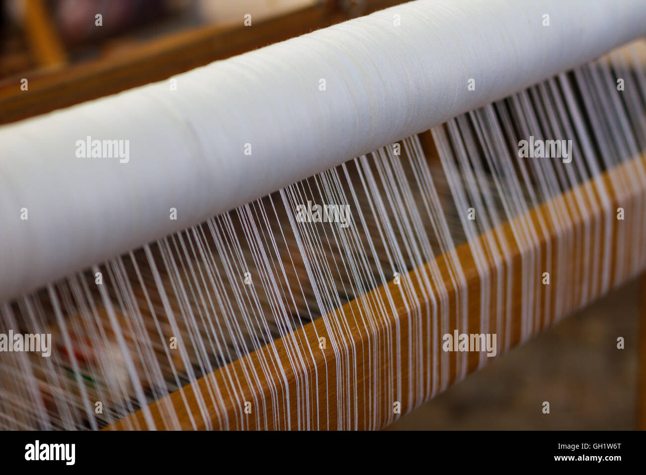 A closeup image of an old weaving Loom and thread of yarn Stock Photo ...