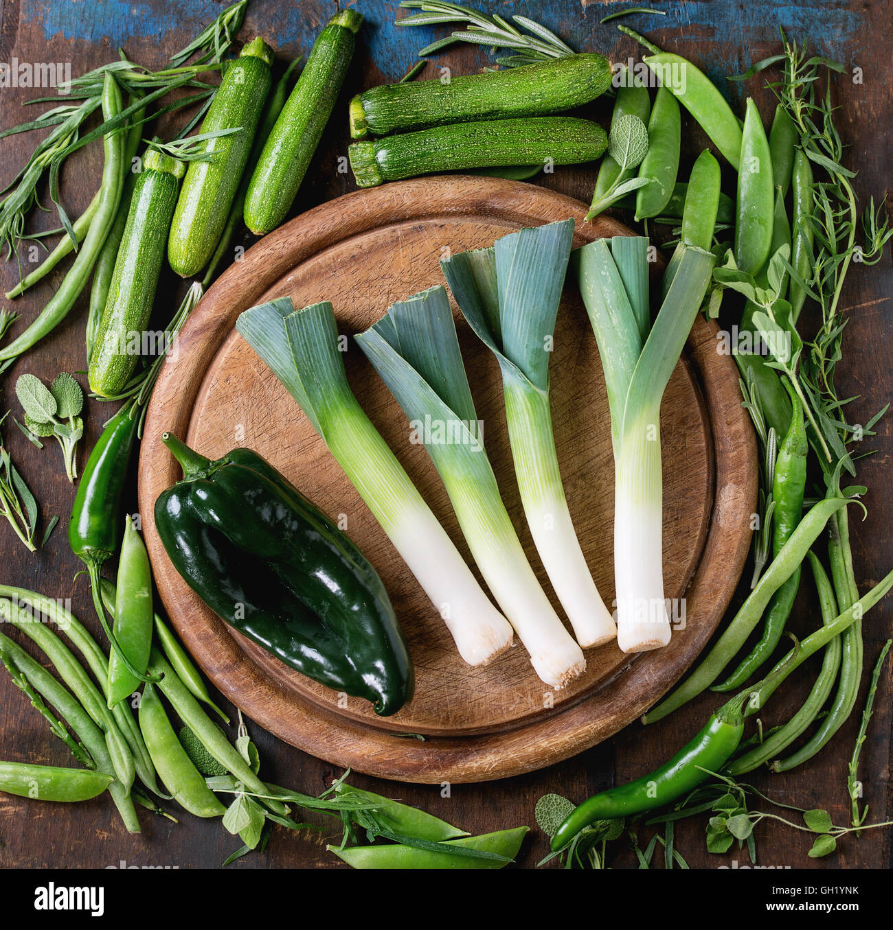 Assortment of fresh raw green vegetables baby leek, zucchini, beans ...