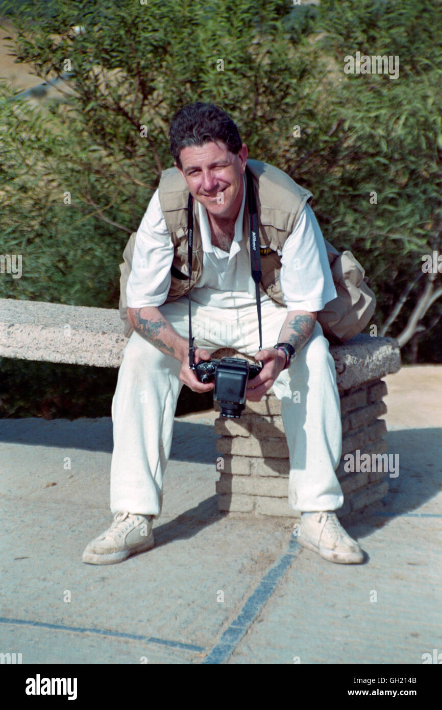 male western tourist sat on roadside seat in israel Stock Photo - Alamy