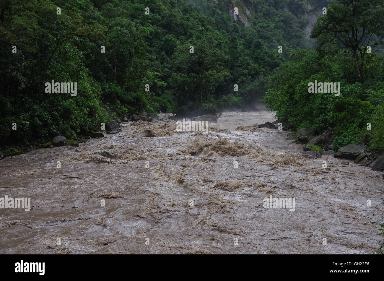 Rapids of Urubamba river near Aguas Calientes village after tropical ...