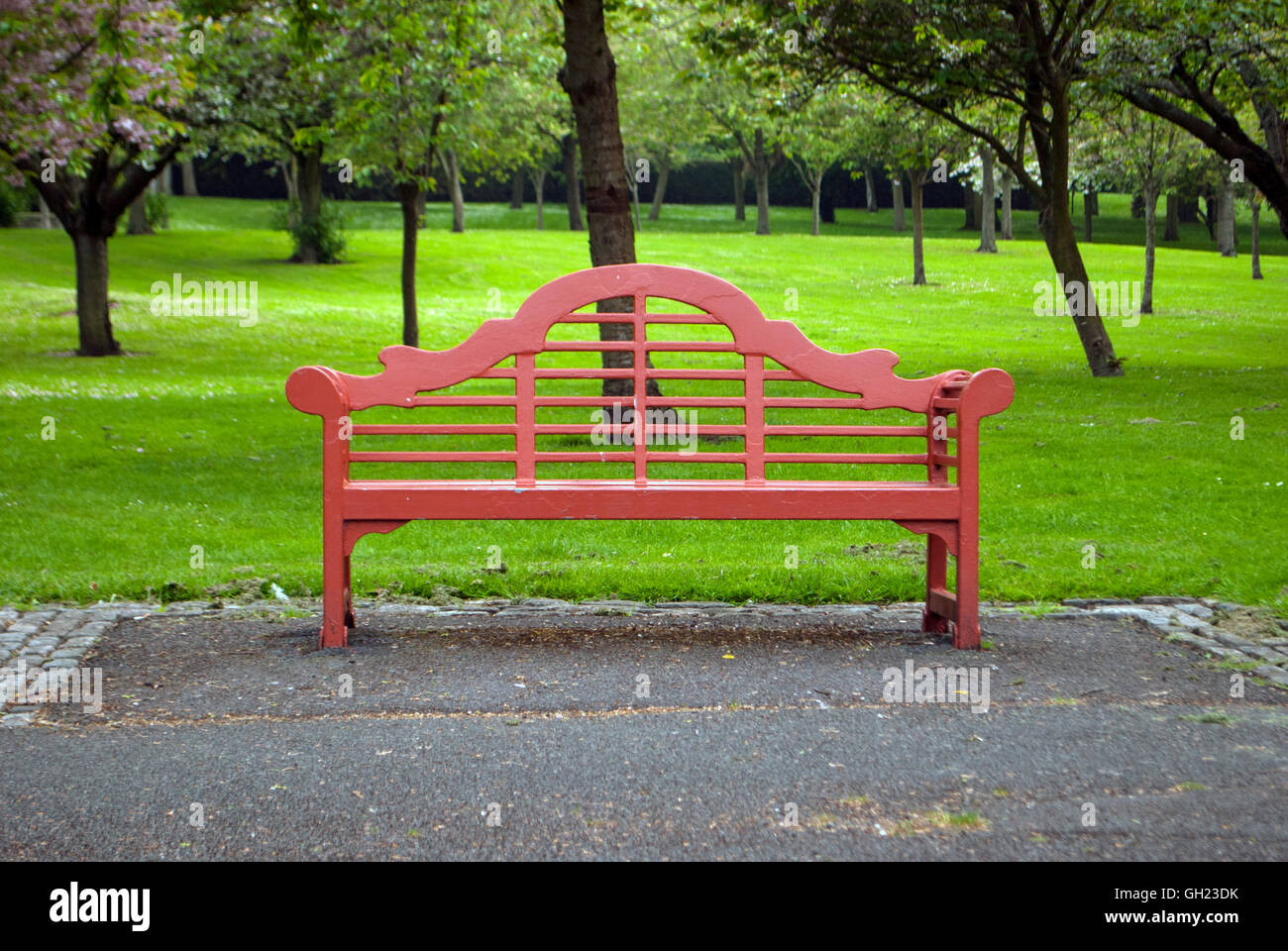 The red bench in a War Memorial Gardens Park in Dublin Stock Photo - Alamy