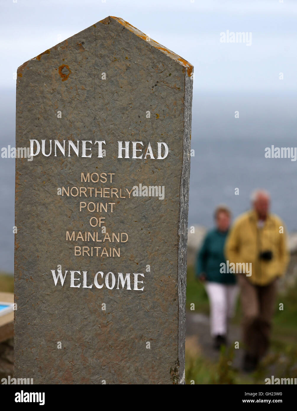 Visitors view the lighthouse at Dunnet Head in the Highlands of ...