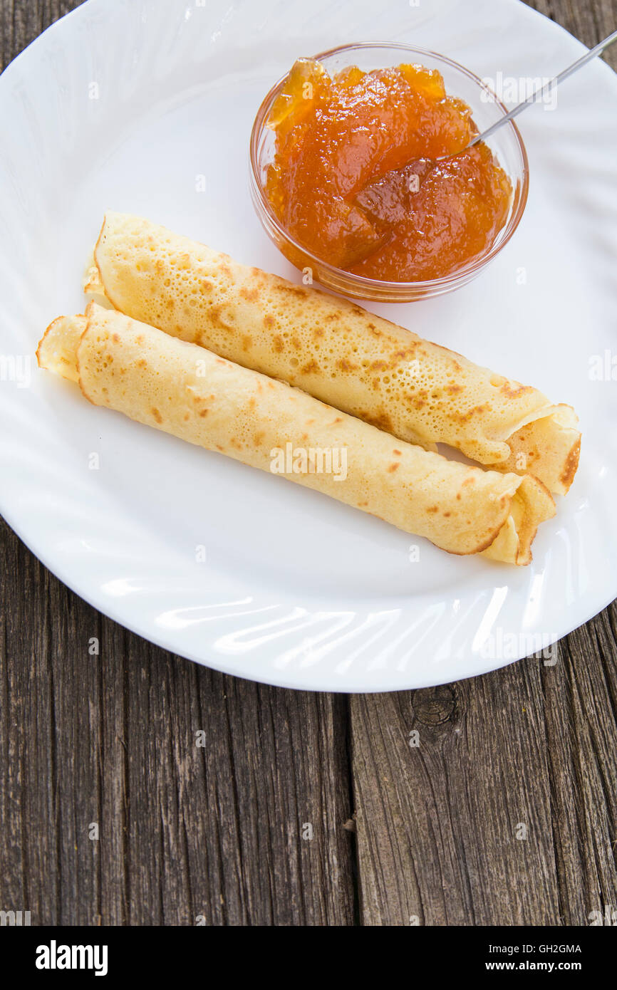 Dessert with tasty apricot roll crepes Stock Photo - Alamy