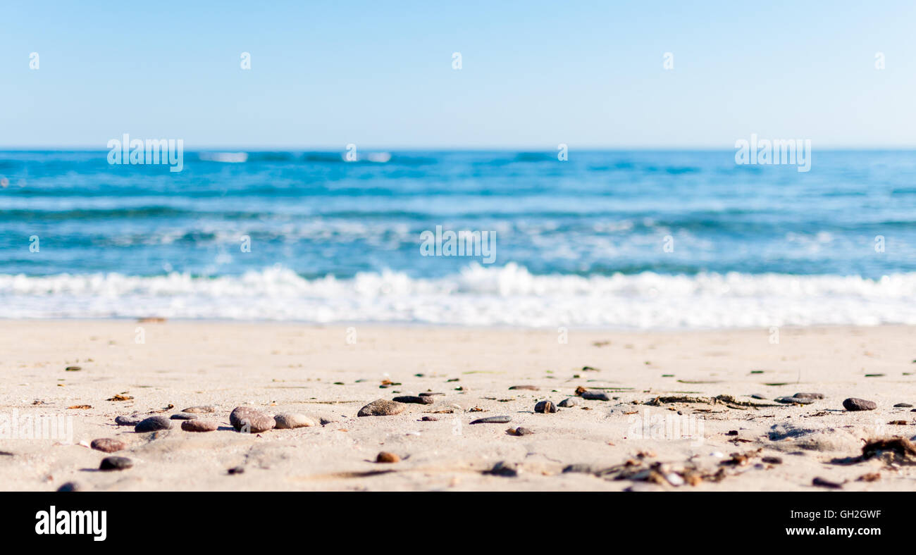Closeup of little rocks on the beach of Platamona - Sardinia in a ...