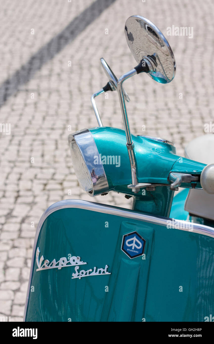 green Vespa sprint scooter in Lisbon, Portugal Stock Photo - Alamy