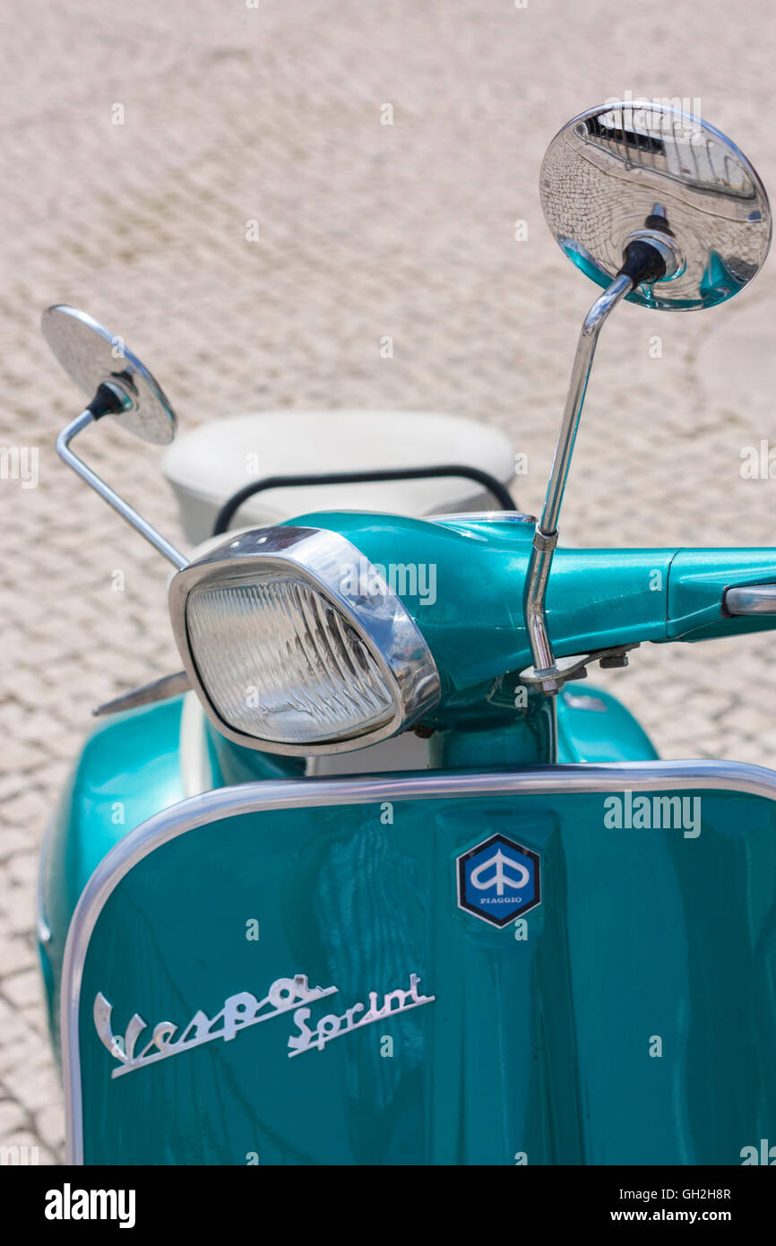 green Vespa sprint scooter in Lisbon, Portugal Stock Photo - Alamy