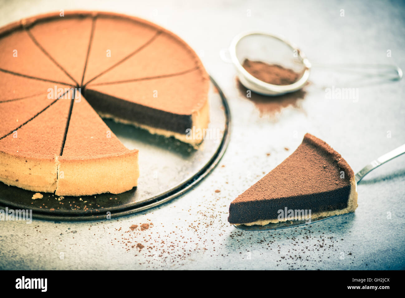 perfectly sliced chocolate cake with cocoa,vintage tonned effect Stock ...
