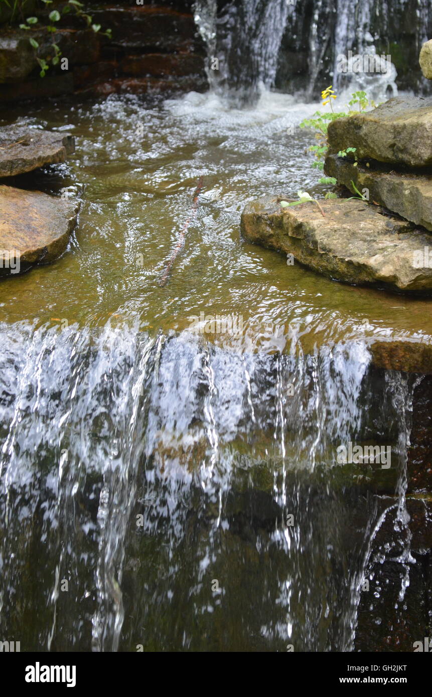 Waterfall surrounded rocks in hi-res stock photography and images - Alamy