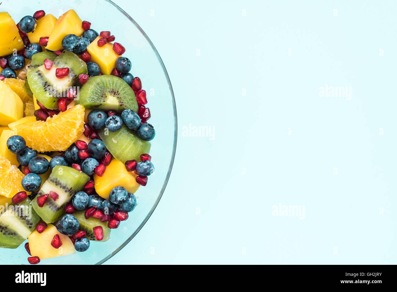 fruit salad in glass bowl, border background Stock Photo - Alamy