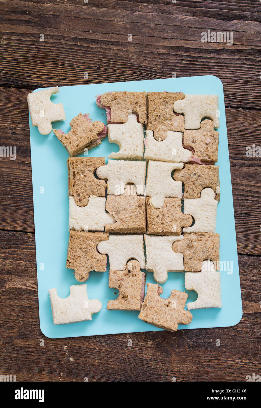 jigsaw puzzle made from bread, kid party food Stock Photo - Alamy
