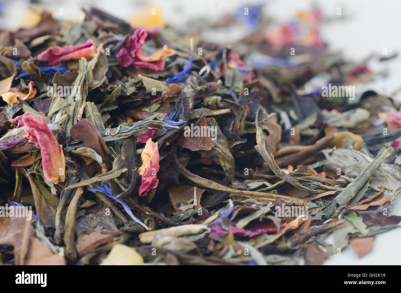 closeup to dried white tea leaves with flower petals Stock Photo - Alamy