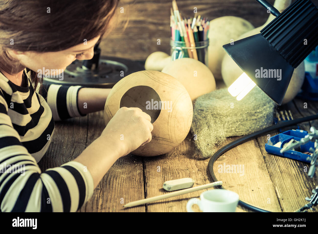 young woman working in hobby craft workshop Stock Photo - Alamy