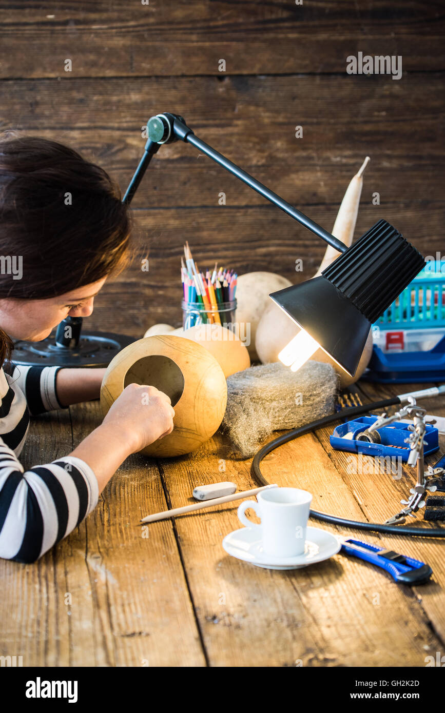 young woman working in hobby craft workshop Stock Photo - Alamy