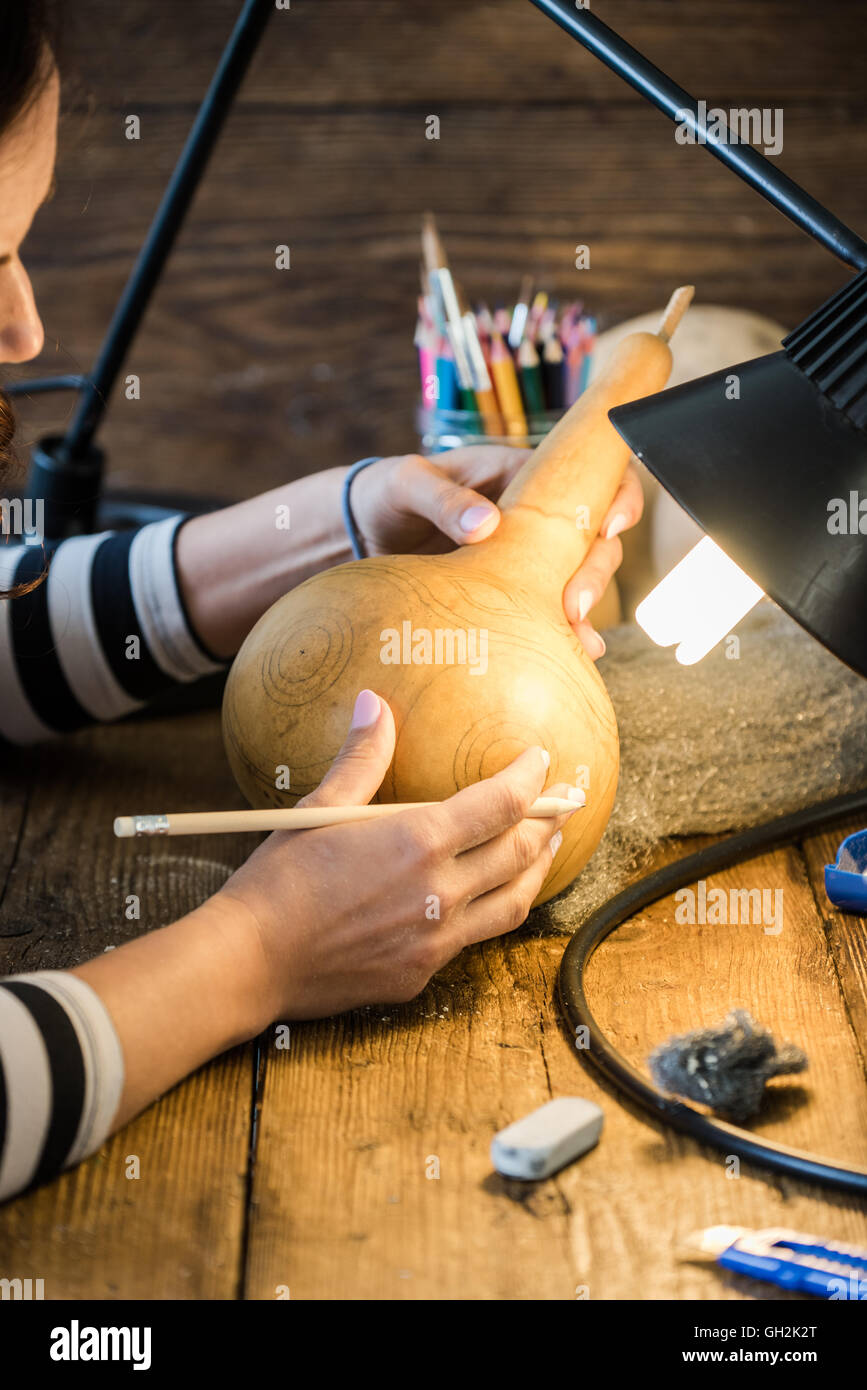 young skilled craftsman works in creative workshop Stock Photo - Alamy