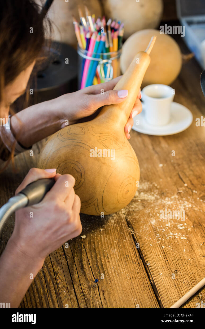 carving in calabash or gourd, creative artisan craft Stock Photo - Alamy