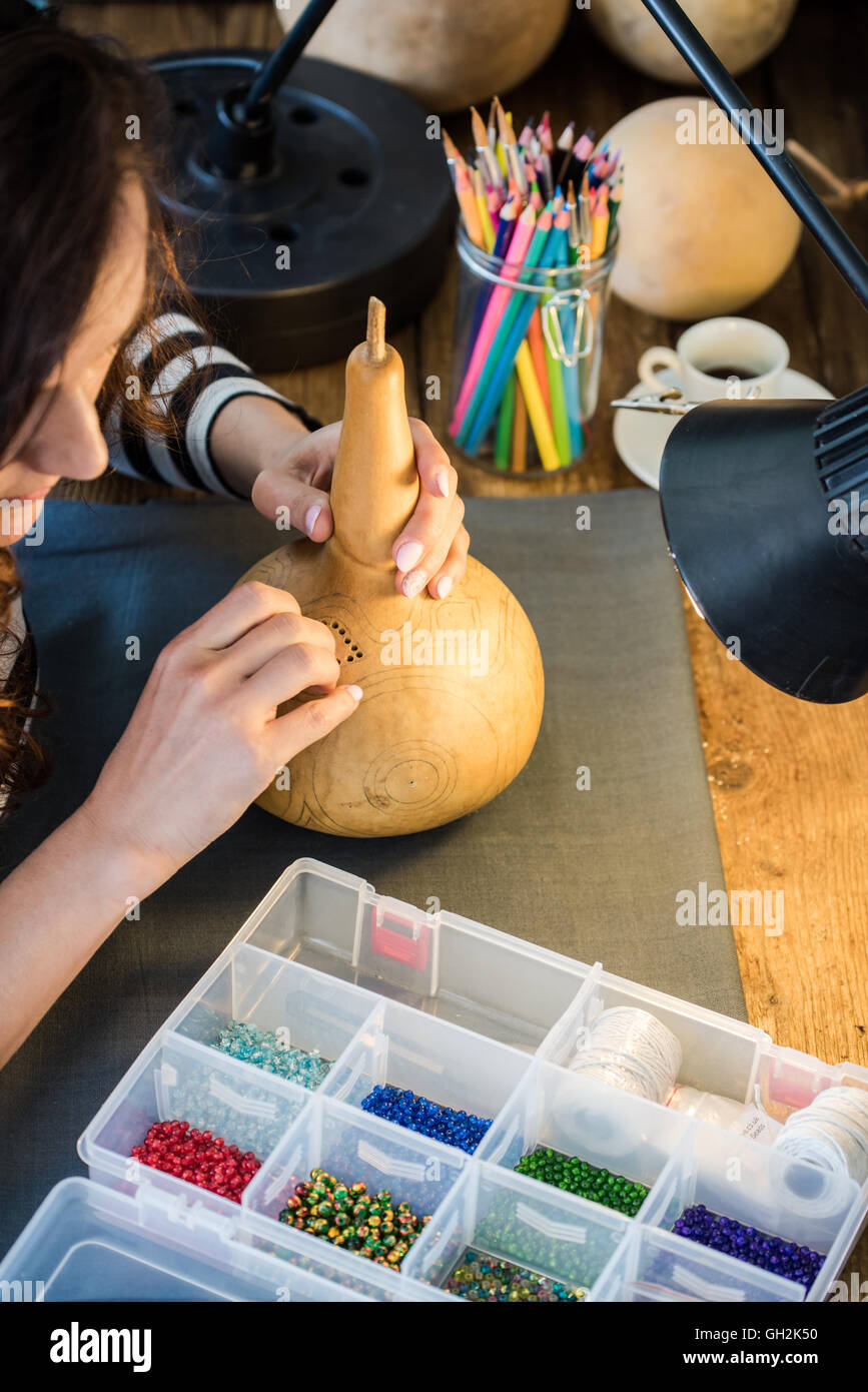 young lady work in creative craft workshop on calabash and gourd Stock ...