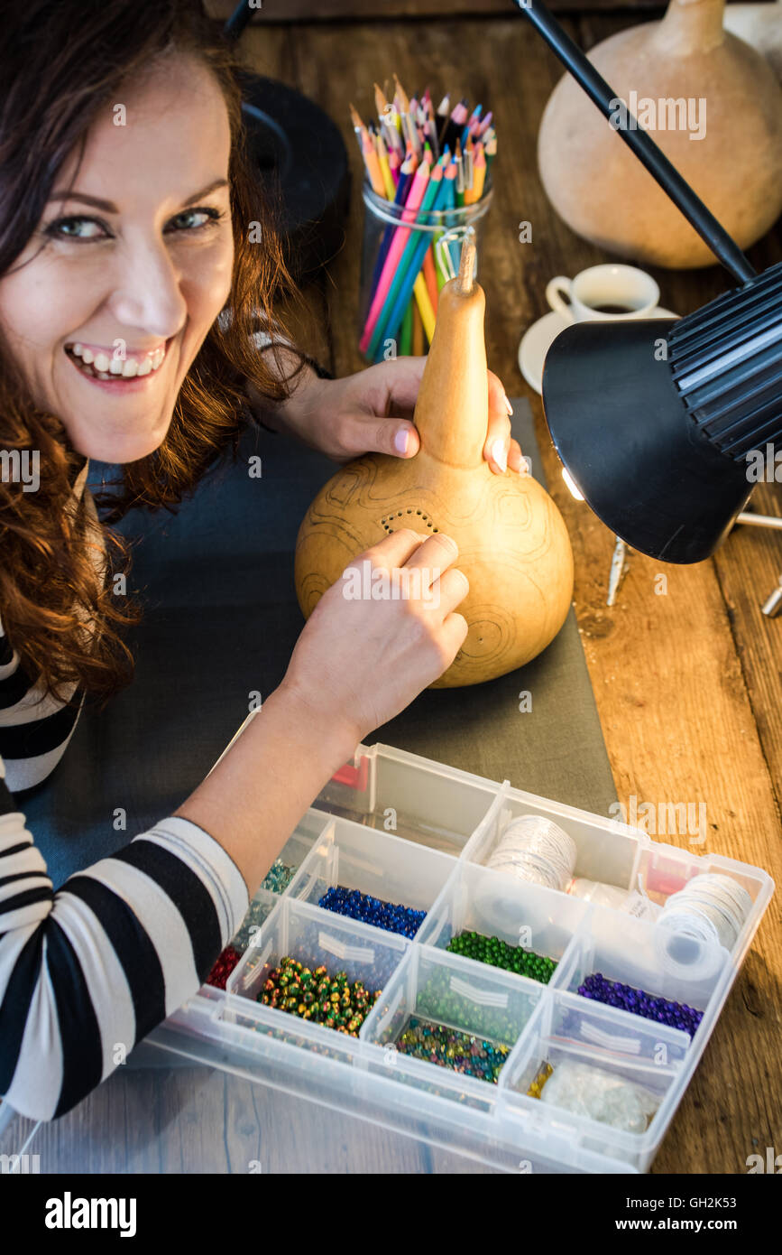 young woman making decorative items in workshop Stock Photo - Alamy