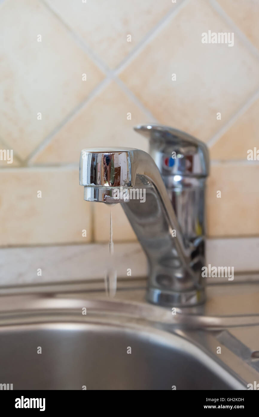 A drop of water on a tap. No water concept. Leaking tap Stock Photo - Alamy