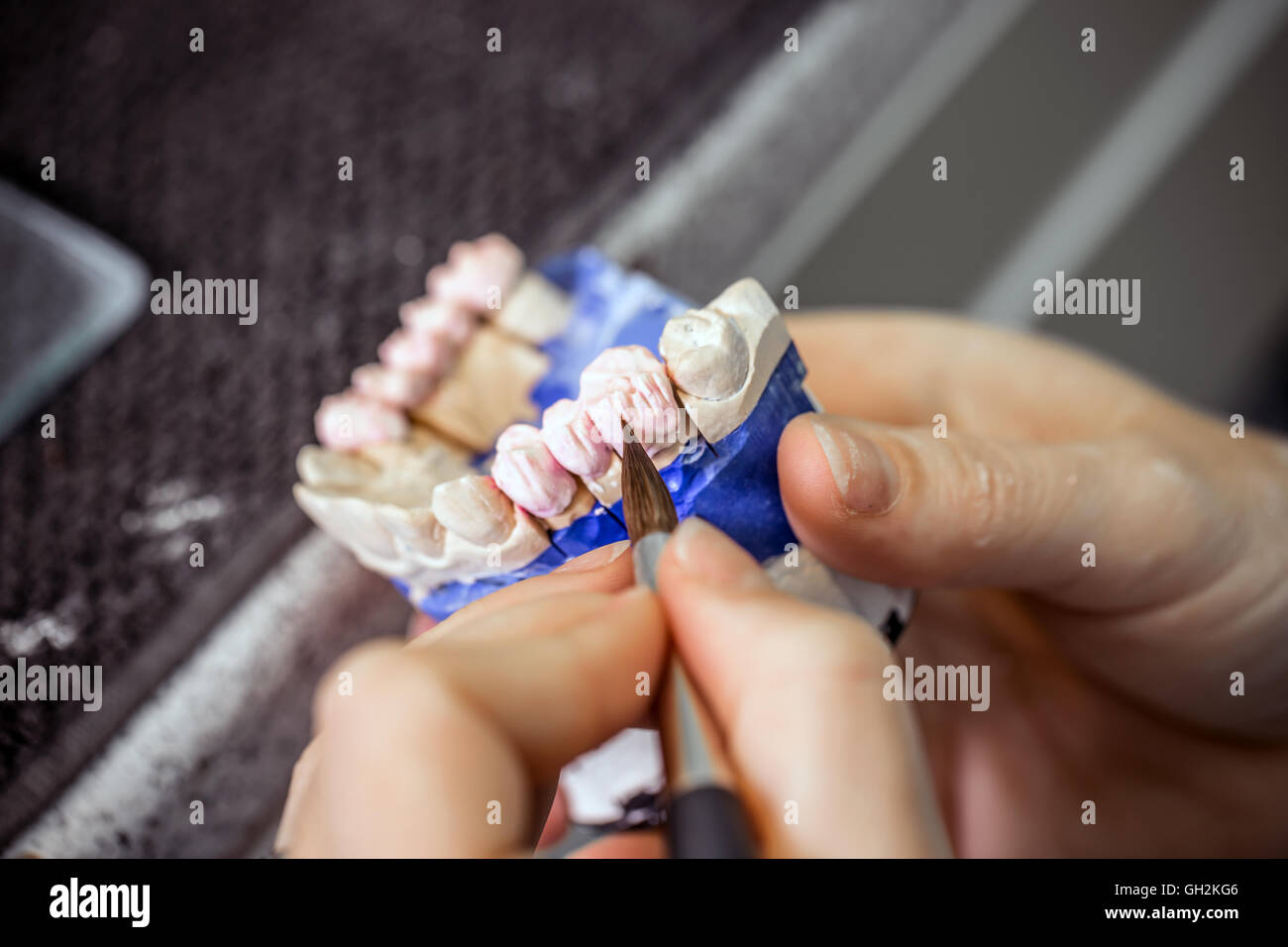 Dental technician working in dental laboratory Stock Photo - Alamy