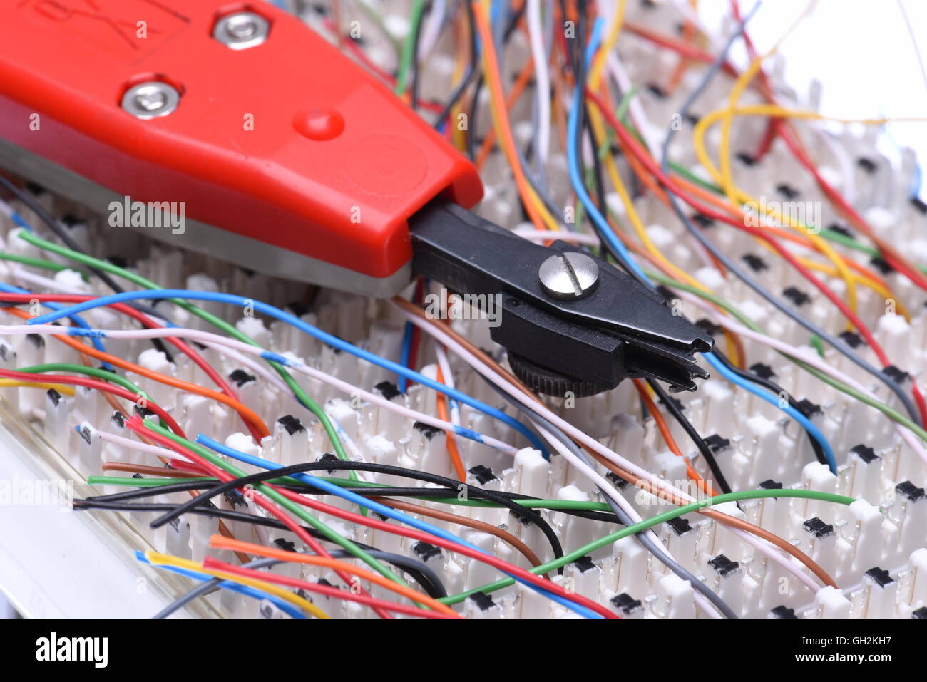 Telecommunication main distribution frame with cables and punching tool ...