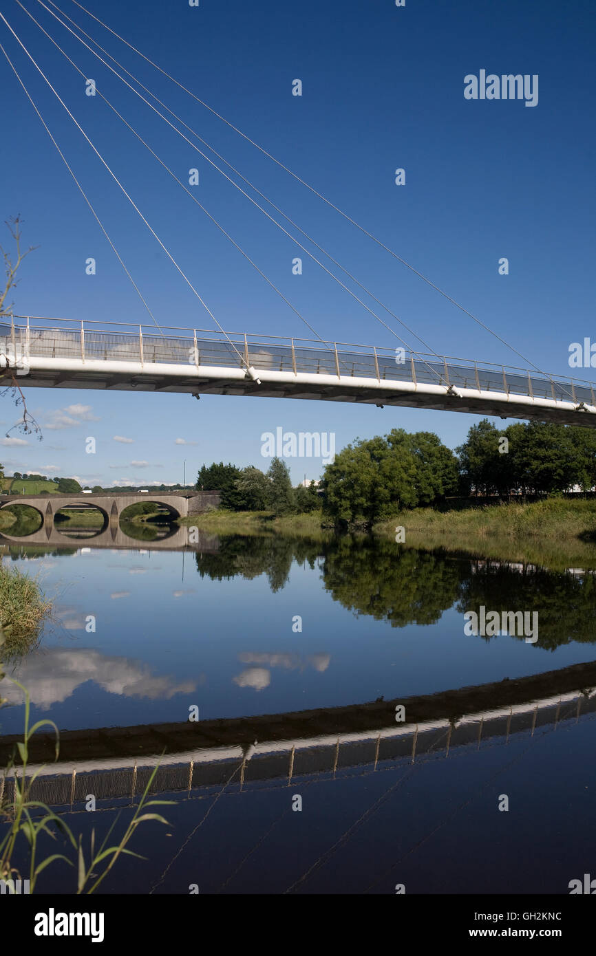 Pedestrian and road bridges over River Towy at Carmarthen on tranquil ...