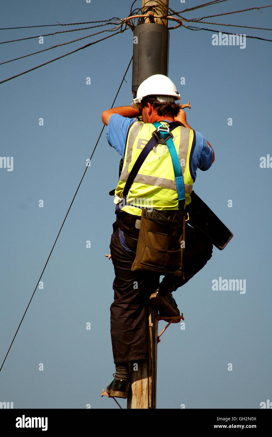 Maintenance engineer on a telegraph pole Stock Photo - Alamy