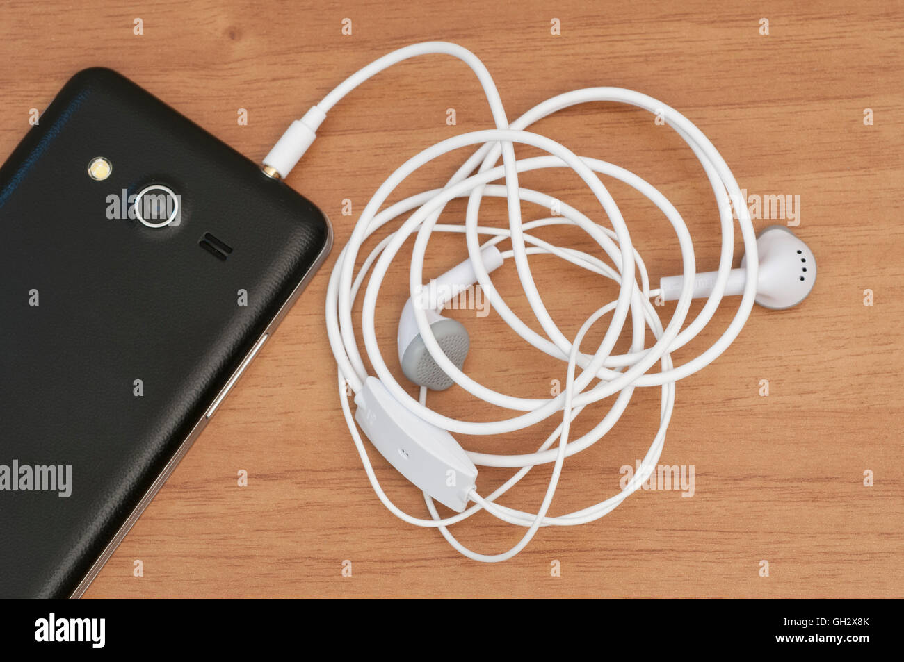 smartphone with headset Stock Photo - Alamy