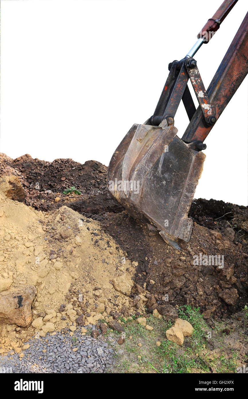 Excavator bucket digging a trench in the dirt ground Stock Photo - Alamy