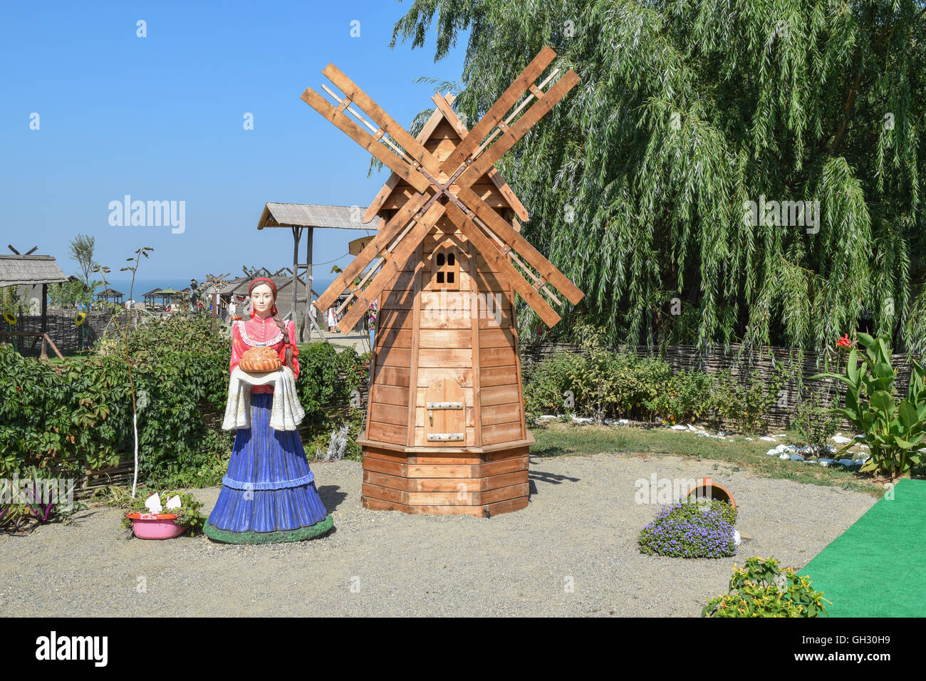 Decorative windmill and the statue of Cossack. Decorative plaster casts ...