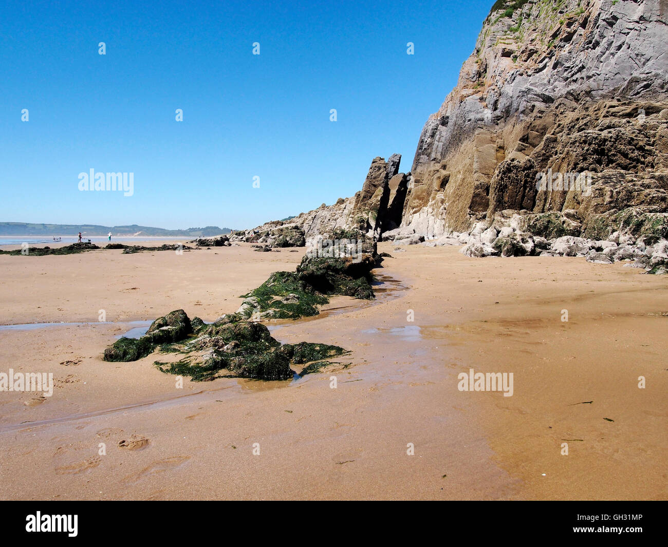 Beach below Great Tor point near Three Cliff Bay, Gower at low water on ...