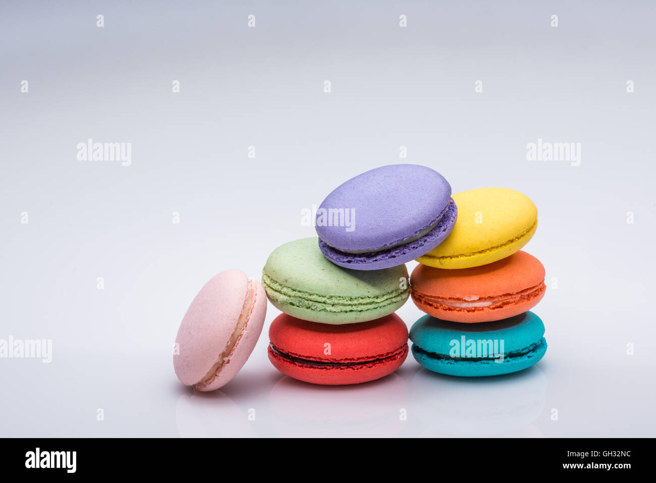 Stack of macaroons on neutral background Stock Photo - Alamy