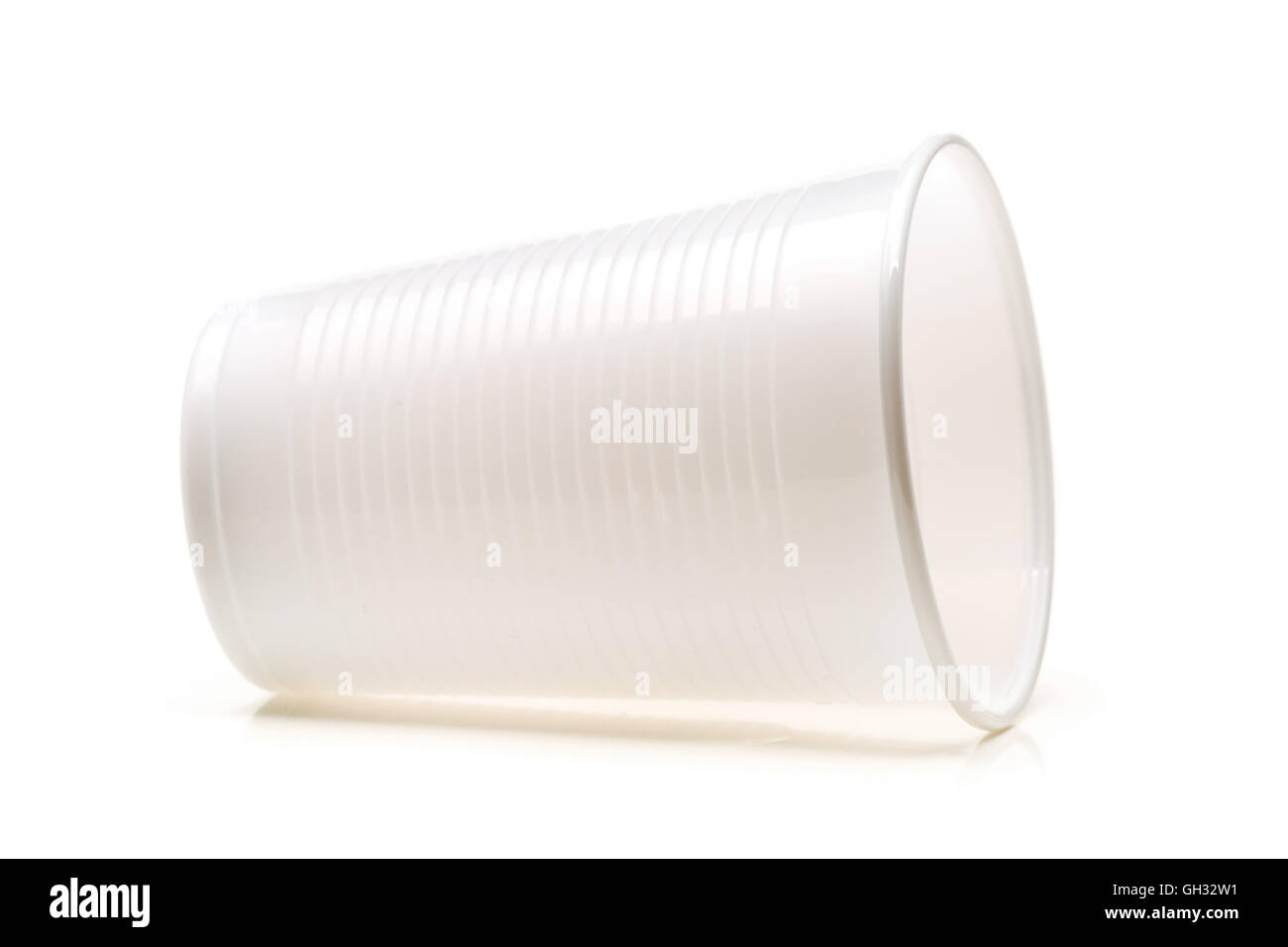 Empty, clean, white plastic cup over white background Stock Photo - Alamy